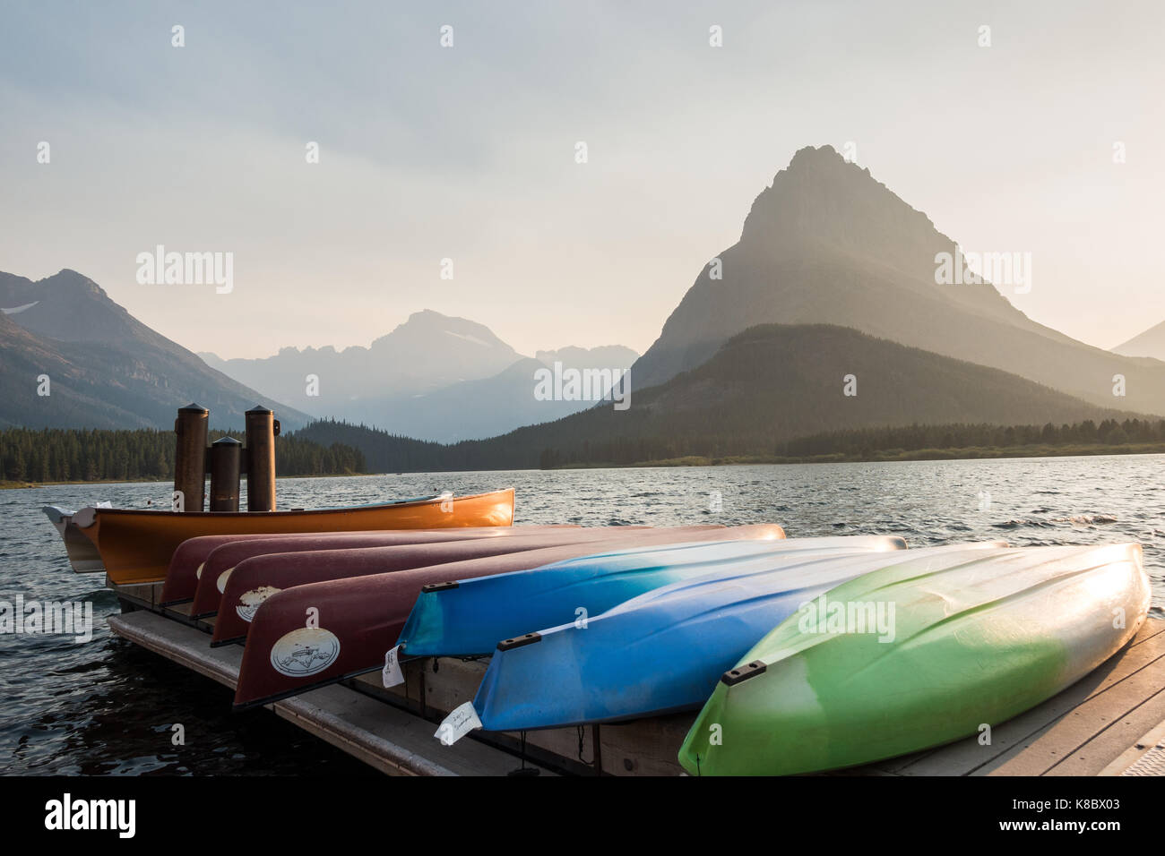 Rental kayaks and canoes on the boat ramp of the Swiftcurrent Lodge ...