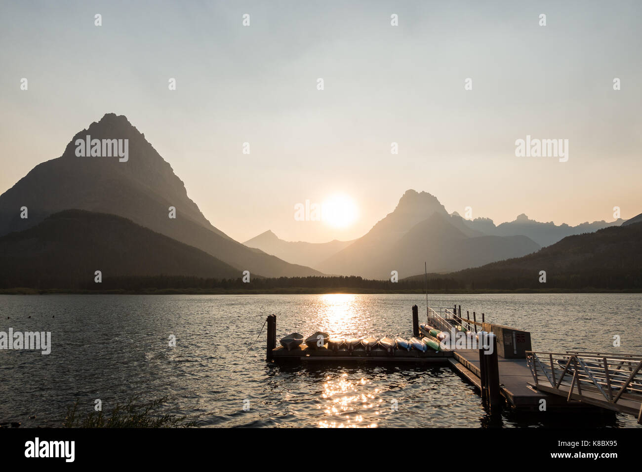 Rental kayaks and canoes on the boat ramp of the Swiftcurrent Lodge ...