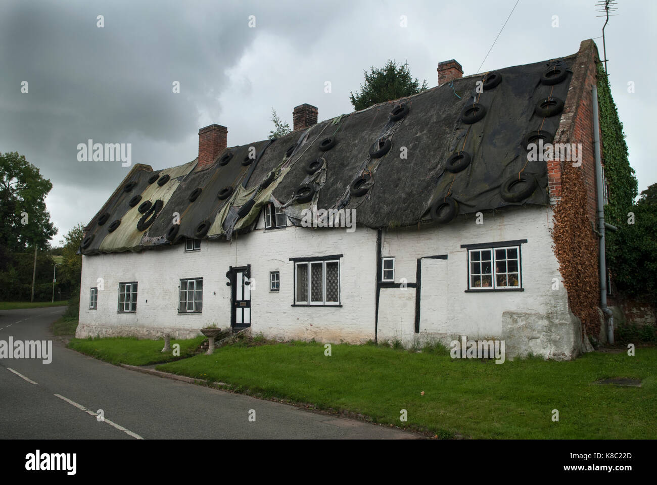 Thatched half timbered timber frame cottage in need of roof repairs ...