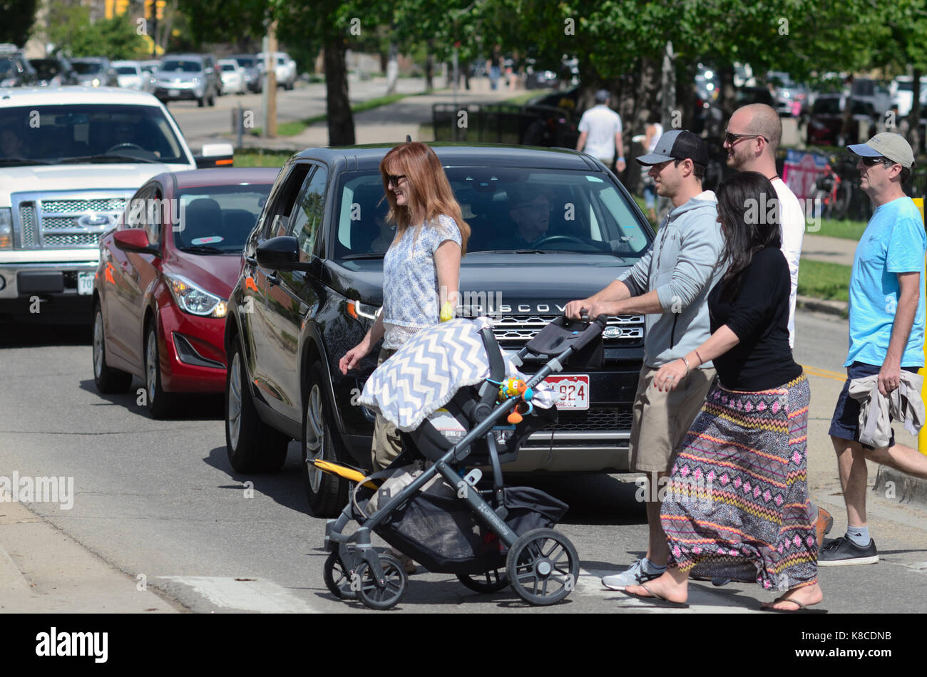 Crossing the street in a crosswalk with a baby carriage, Traffic ...