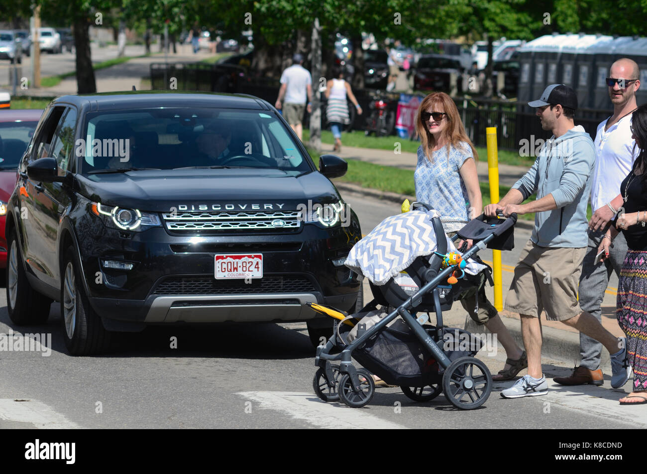 Crossing the street in a crosswalk with a baby carriage, Traffic ...