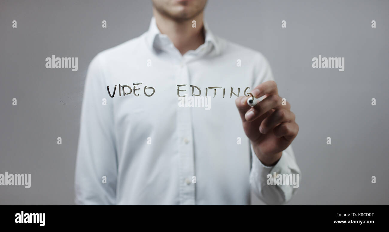 Video editing , Man Writing on Glass Stock Photo - Alamy