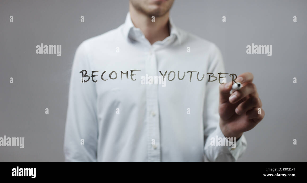 Become youtuber , Man Writing on Glass Stock Photo - Alamy