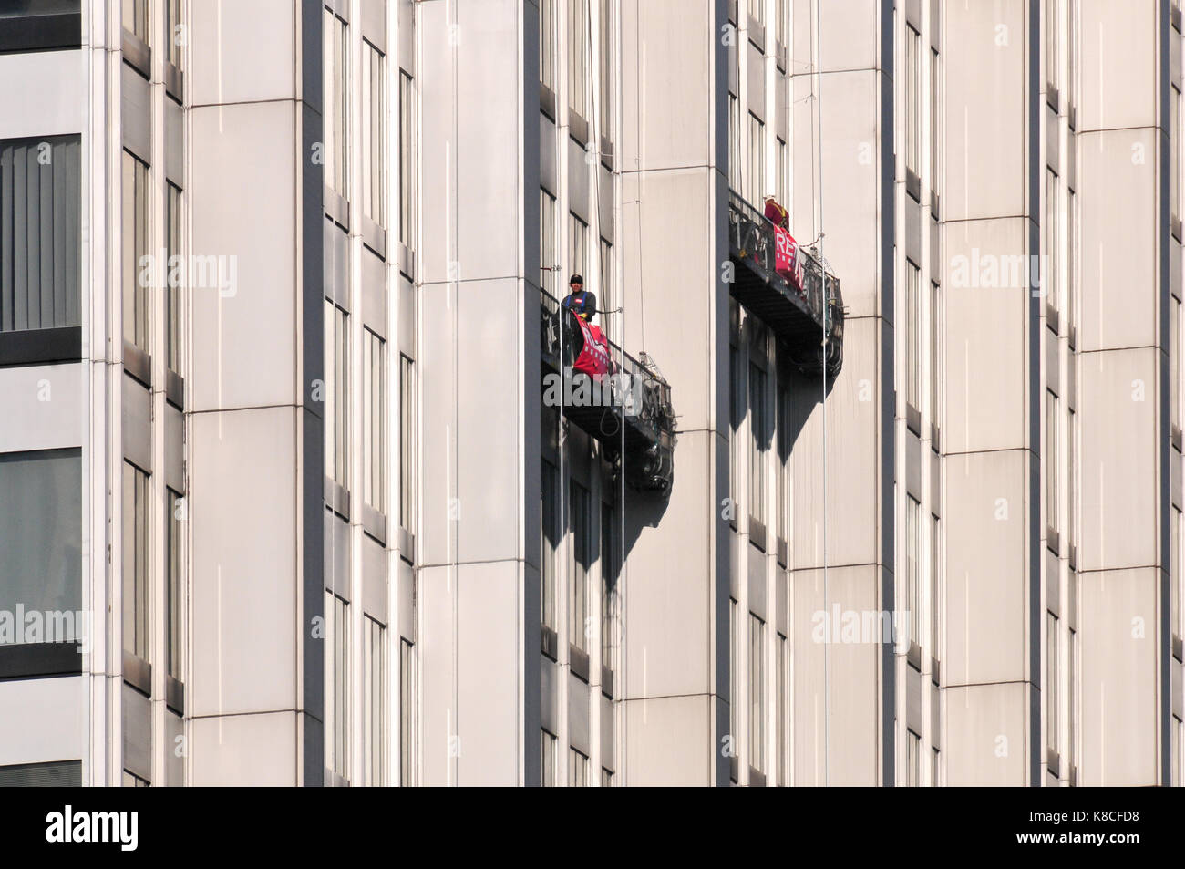 Window washer in an office tower in downtown Manhattan in New York City ...