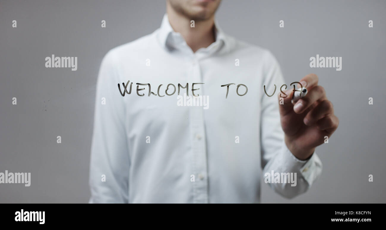 Welcome to USA , Man Writing on Glass Stock Photo - Alamy