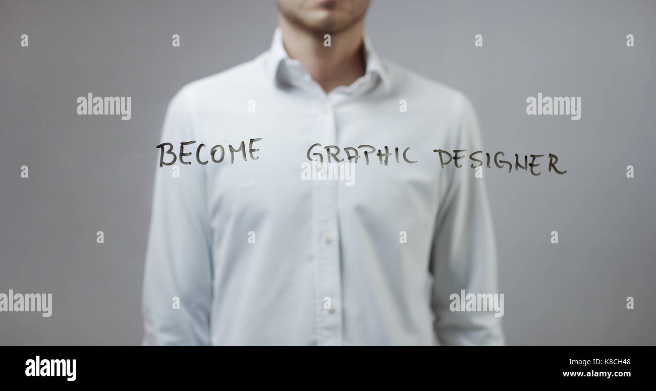 Become graphic designer , Man Writing on Glass Stock Photo - Alamy