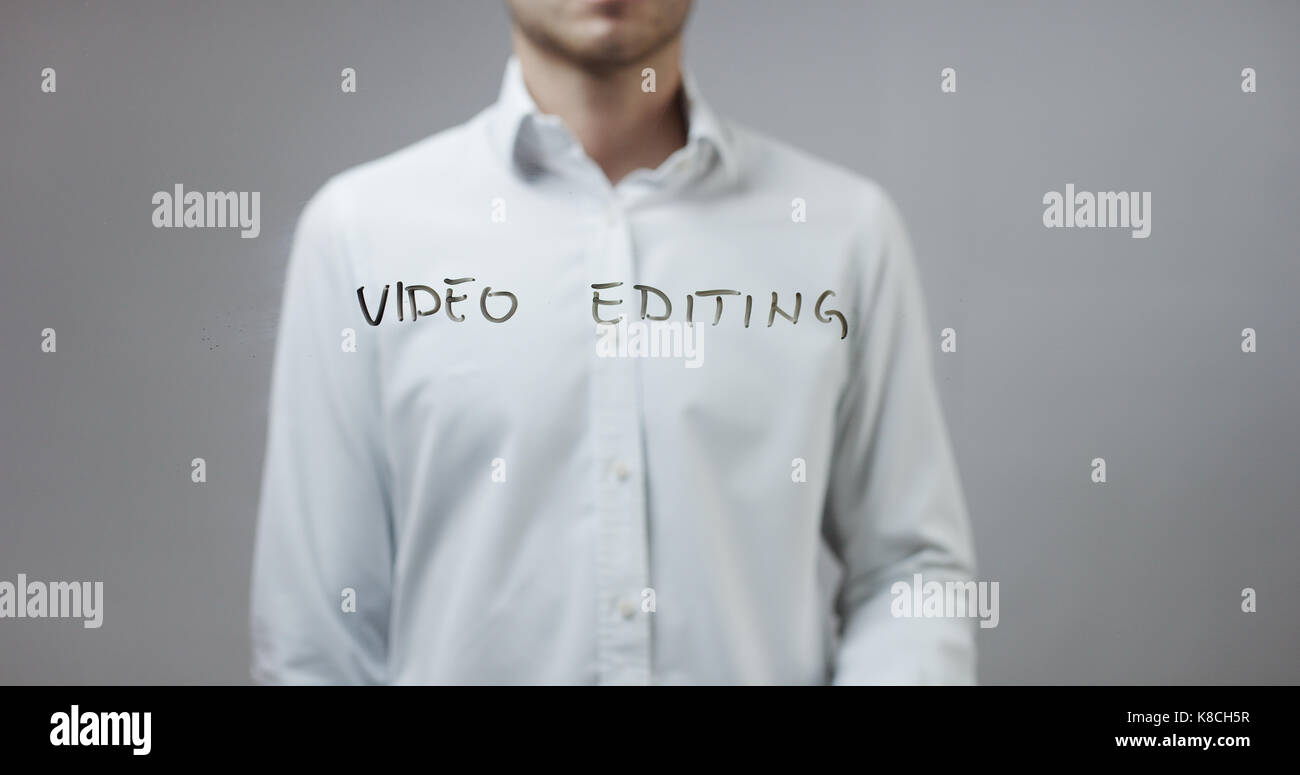 Video editing , Man Writing on Glass Stock Photo - Alamy