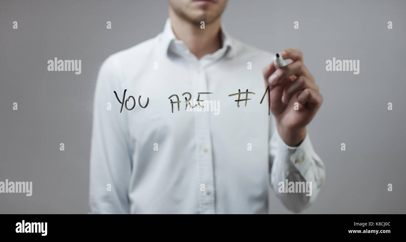 You are #1 , Man Writing on Glass Stock Photo - Alamy