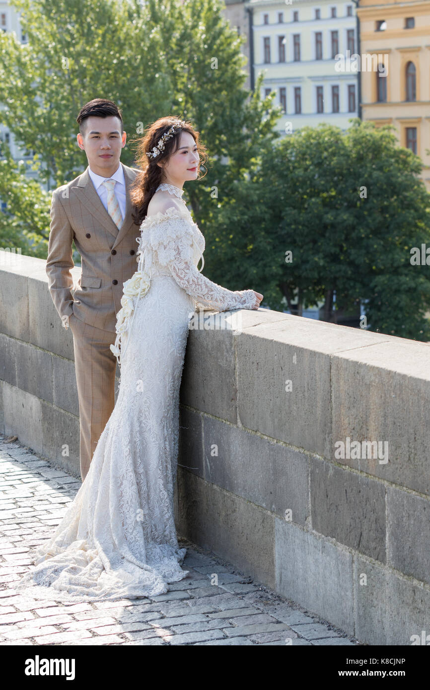 Prague, Czech Republic - August 21, 2017: Asian bridegroom and bride ...