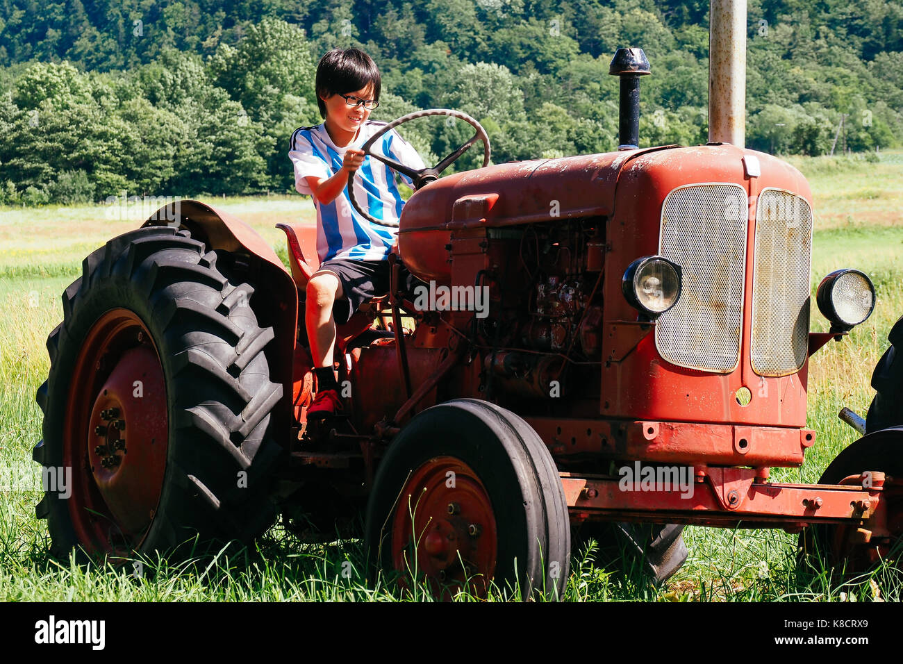 Children on Tractor Stock Photo - Alamy
