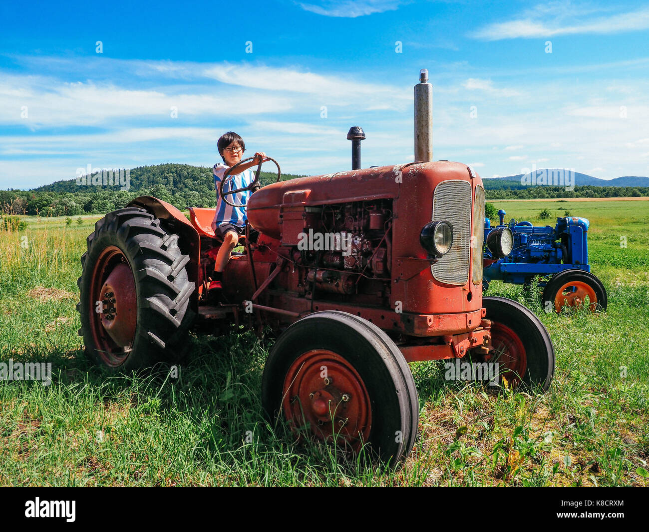 Children on Tractor Stock Photo - Alamy