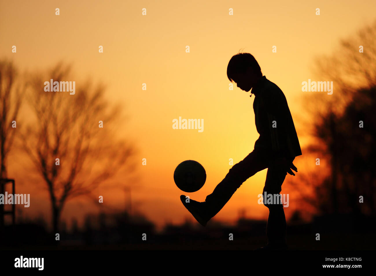 Child Lifting Ball Stock Photo - Alamy