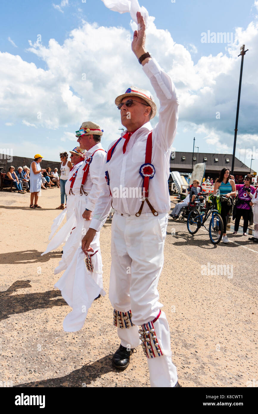 Hartley Morris dancers in all white shirt and trousers, red braces and ...