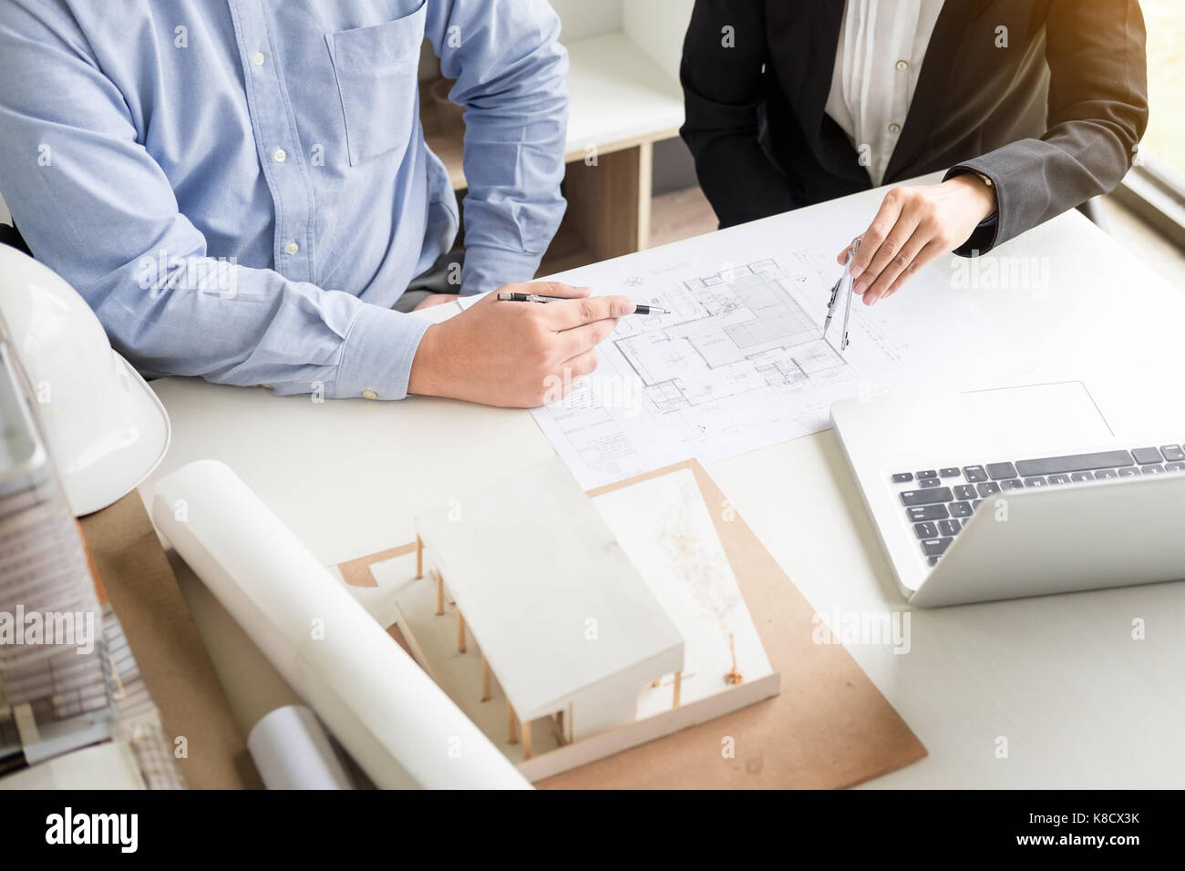 Person's engineer Hand Drawing Plan On Blue Print with architect ...