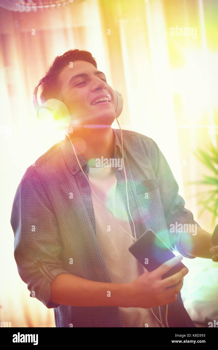 Teen boy listening headphones dancing hi-res stock photography and ...