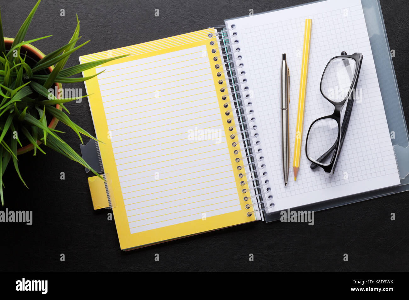 Office desk with notepad and supplies. Top view with space for your ...