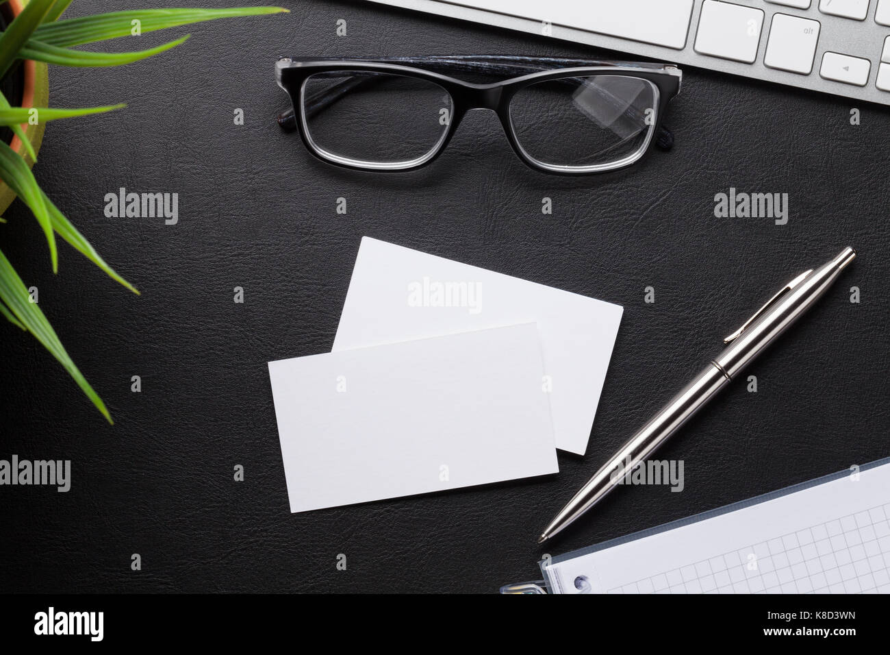 Office desk with computer and supplies. Blank business cards. Top view ...