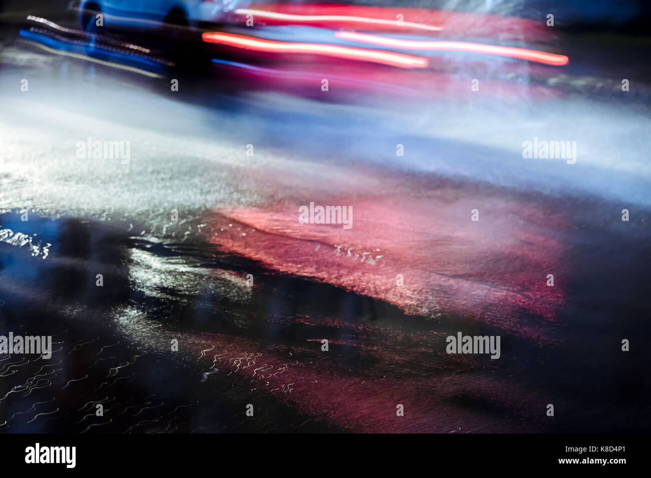 car in motion splashing rain water driving at night blurred view Stock ...