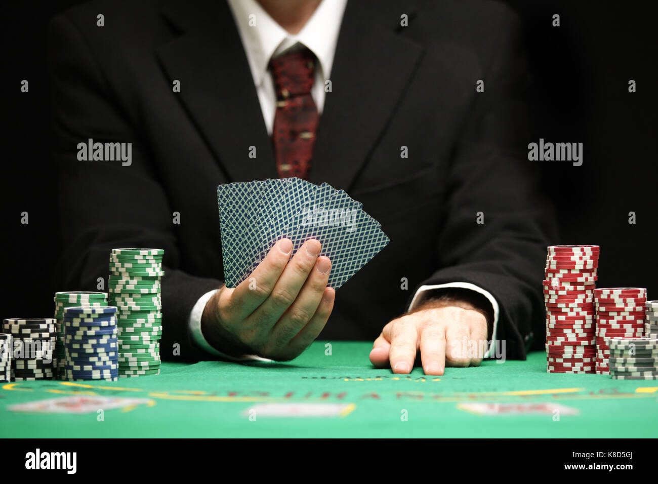Blackjack Or Poker Game, Casino Worker Shuffling Cards Stock Photo - Alamy