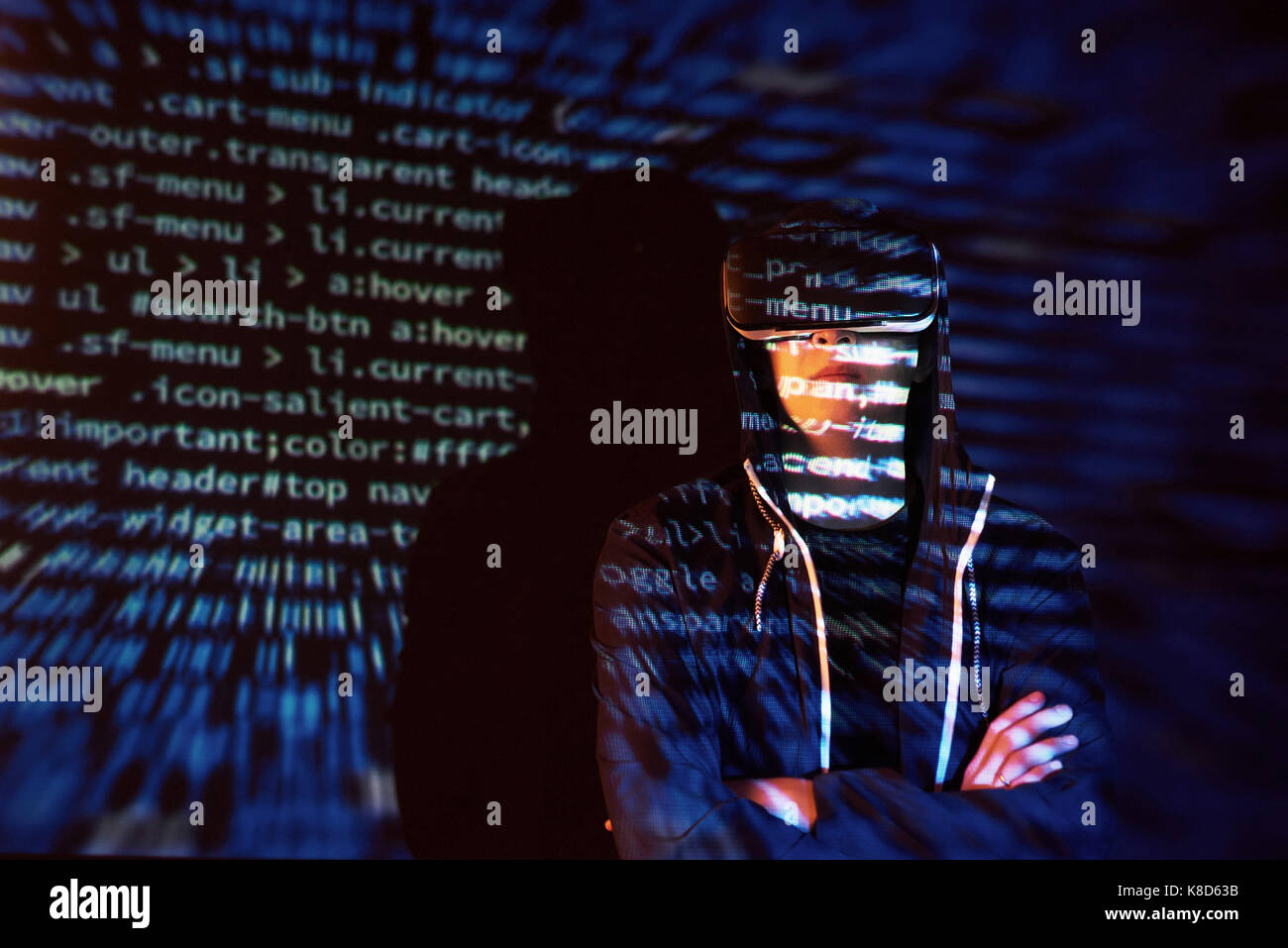 Cyber attack with unrecognizable hooded hacker using virtual reality ...