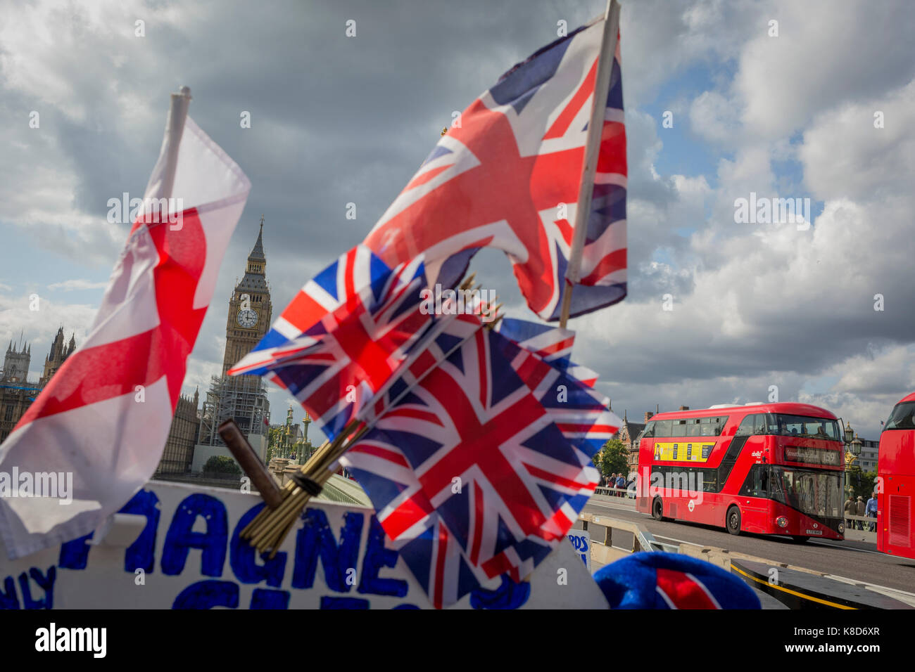Union Jack flags and red London Routemaster buses on Westminster Bridge ...