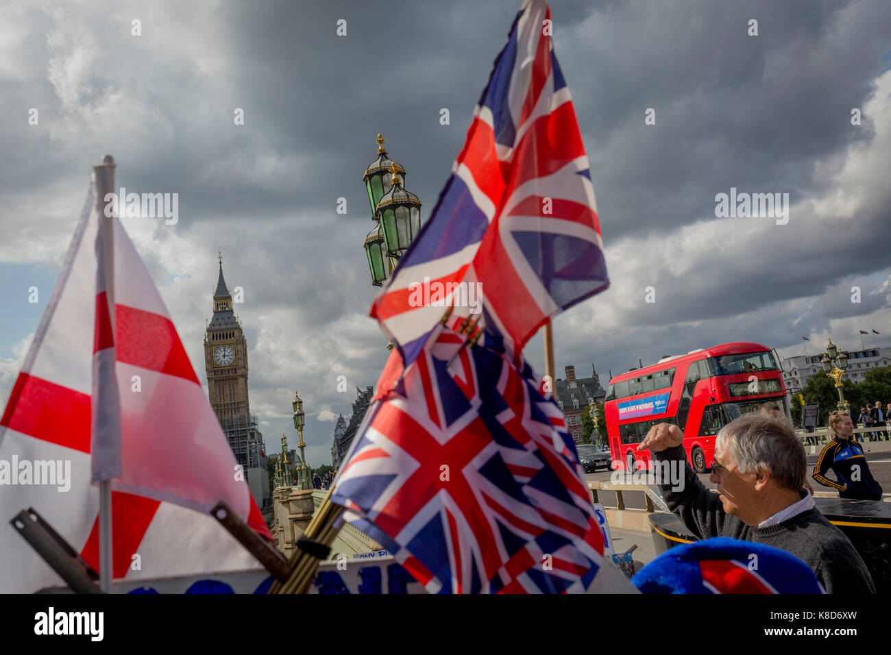 Union Jack flags and a red London Routemaster bus on Westminster Bridge ...
