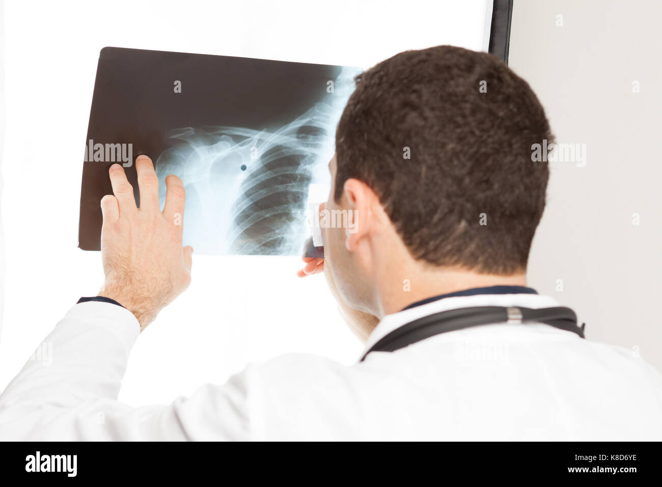 Doctor checking x-ray Stock Photo - Alamy