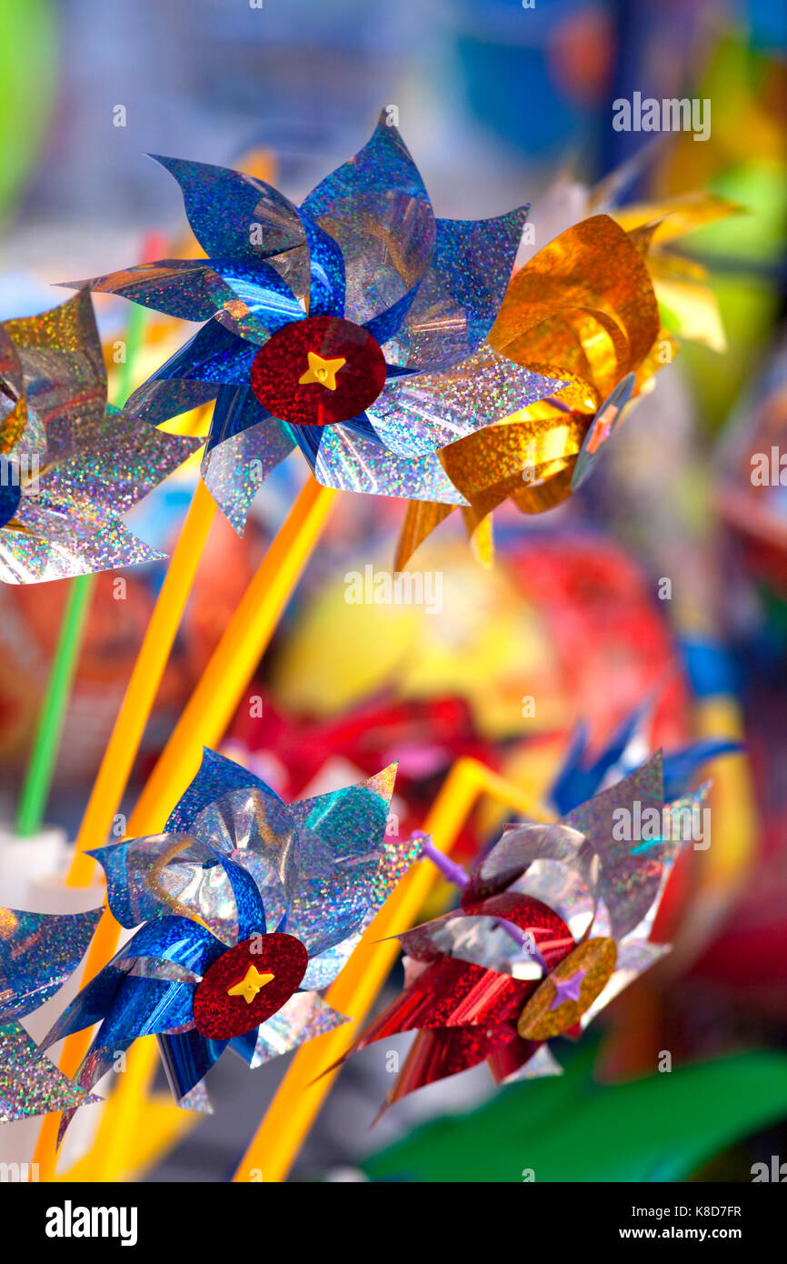 Colorful plastic weathervanes in a toy store Stock Photo - Alamy