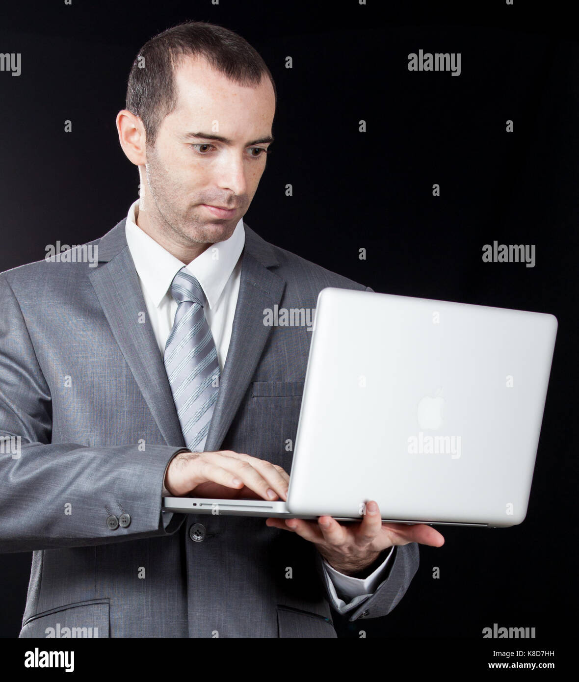 Businessman with laptop Stock Photo - Alamy