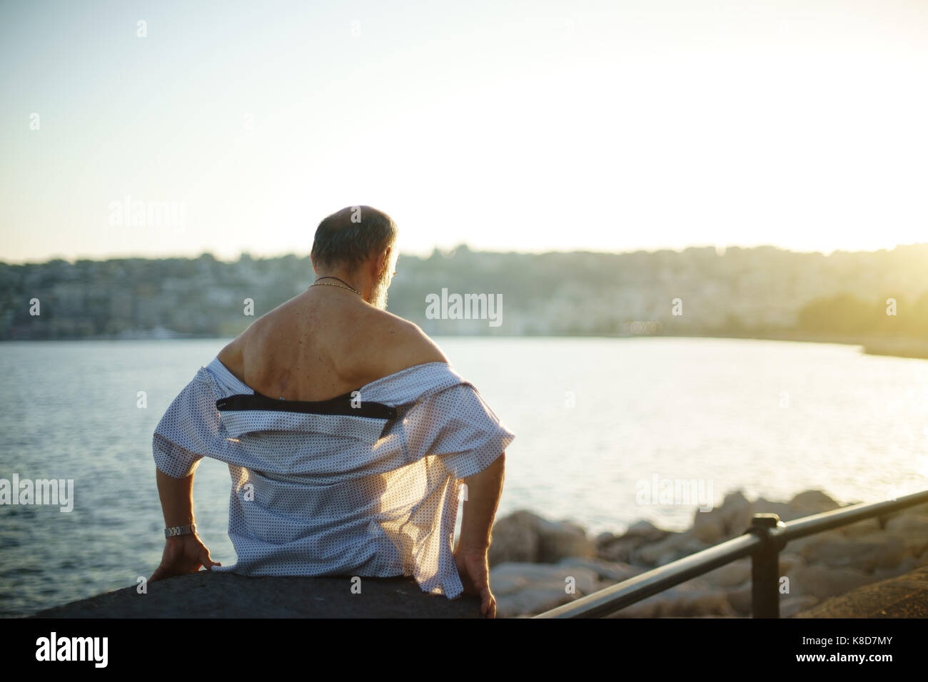 men taking sun, in Naples, Italy Stock Photo - Alamy