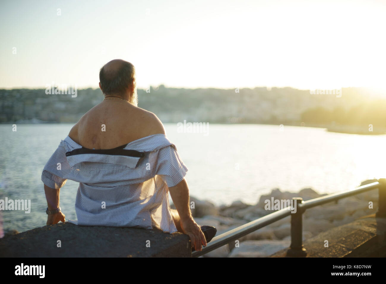 men taking sun, in Naples, Italy Stock Photo - Alamy