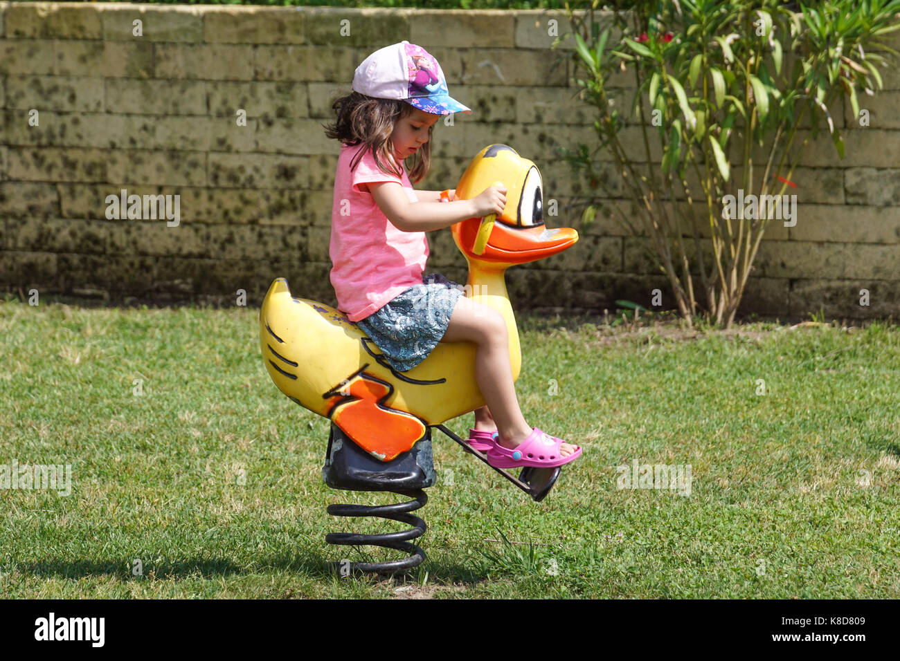 MILAN , ITALY 29 JULY 2017 : Unidentified little girl plays with a ...