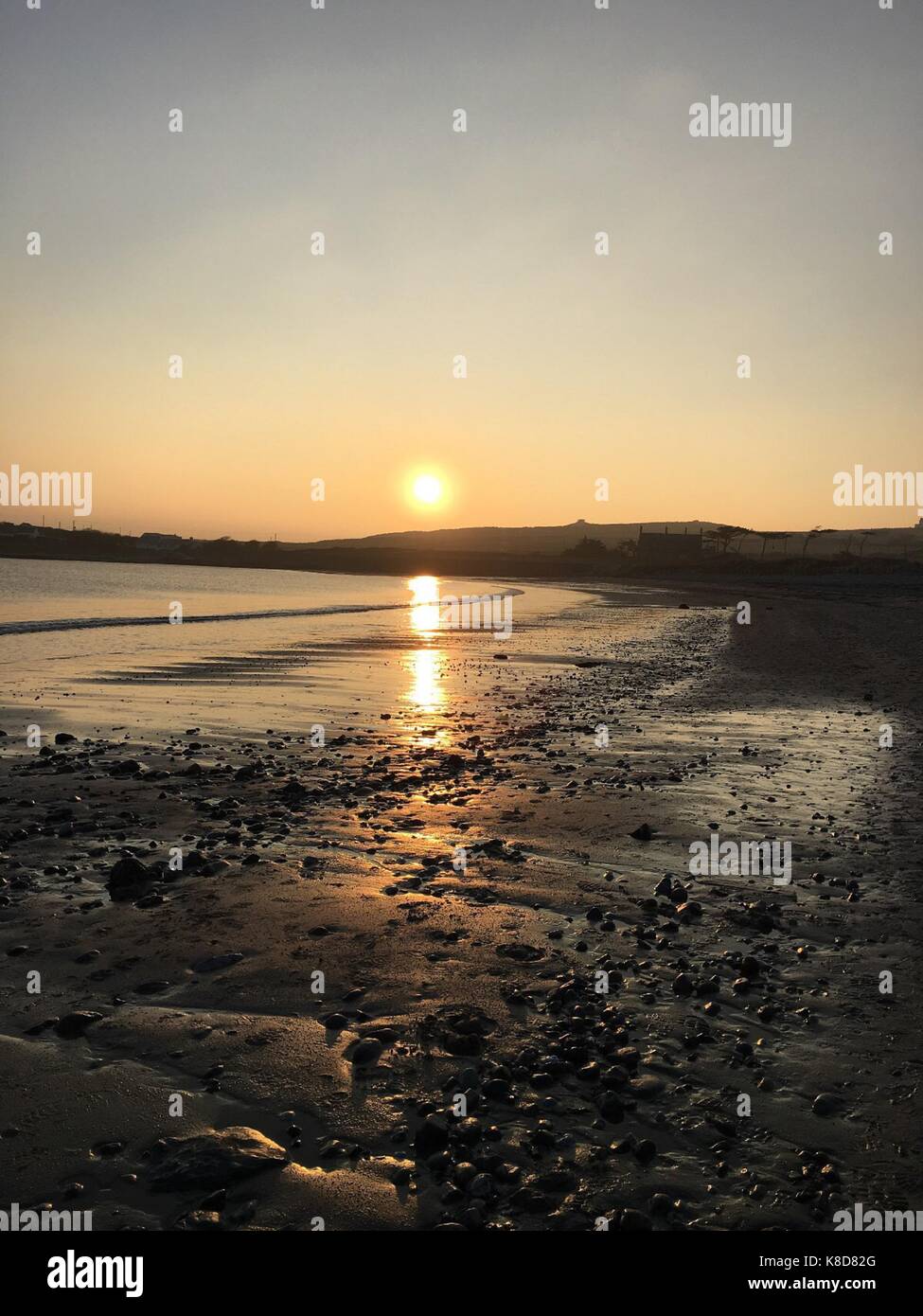 Beautiful sunset with reflection on Rhoscolyn Beach, Anglesey Stock ...