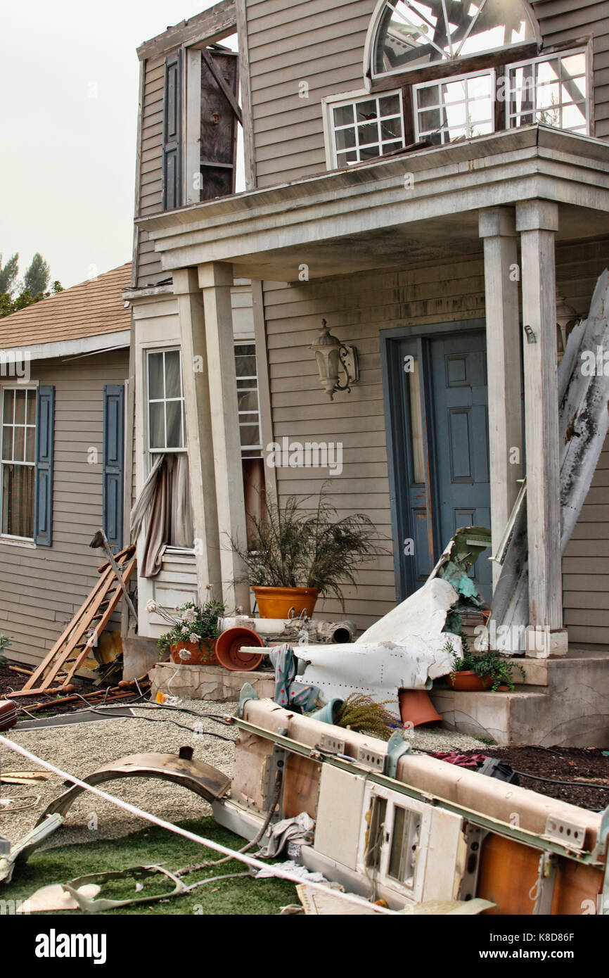 Wooden house damaged by disaster Stock Photo - Alamy