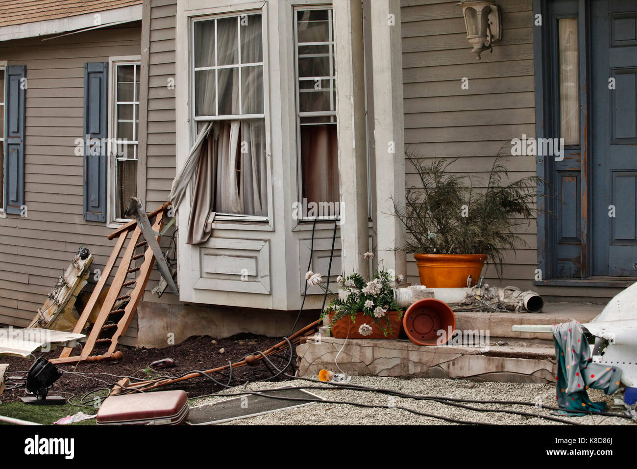 Wooden house damaged by disaster Stock Photo - Alamy