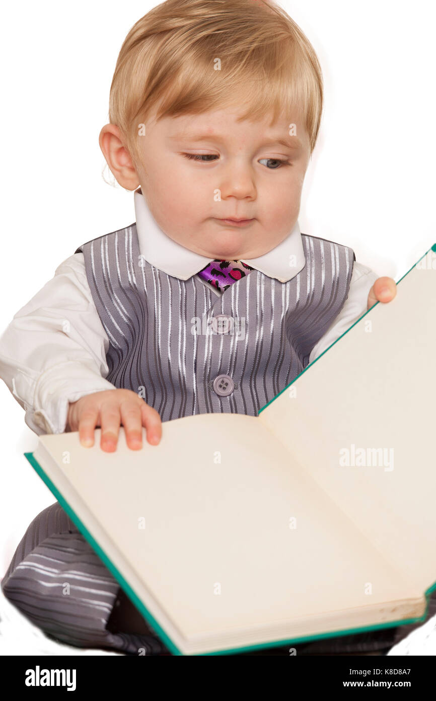 Baby boy reading a book Stock Photo - Alamy