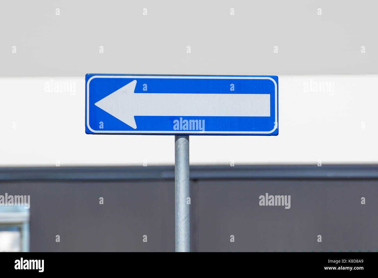 White one way traffic sign against industrial background Stock Photo ...
