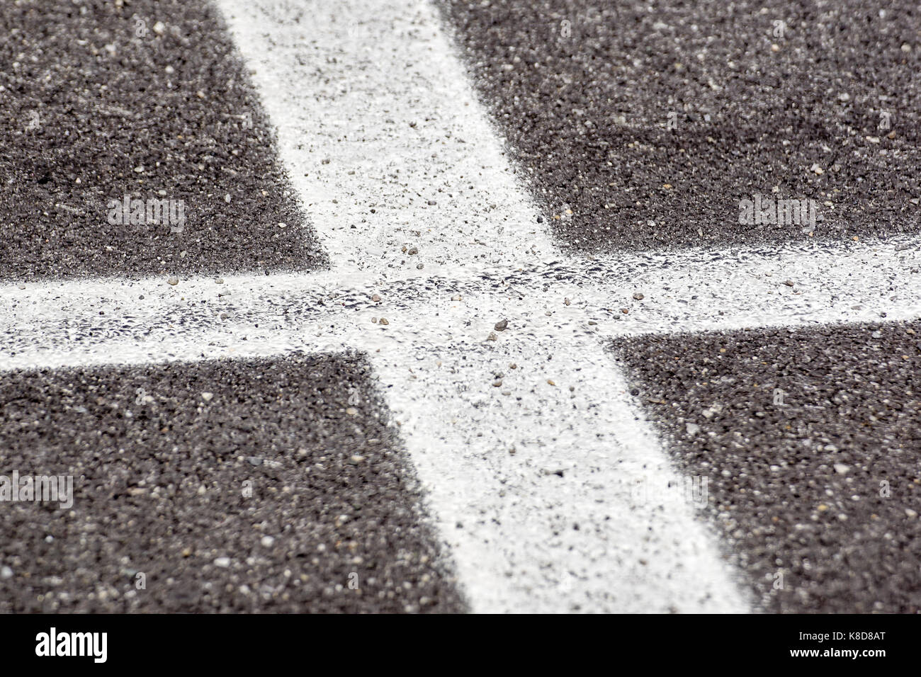 Asphalt with cross stripe white line in prespective Stock Photo - Alamy