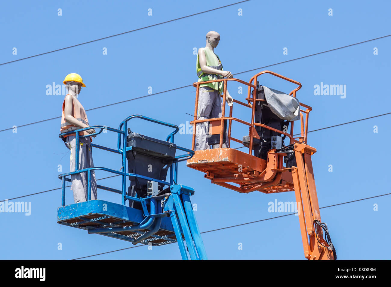 Hydraulic mobile construction platform elevated towards a blue sky with ...