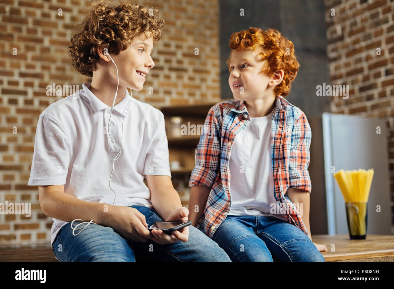 Friendly children talking together at home Stock Photo - Alamy