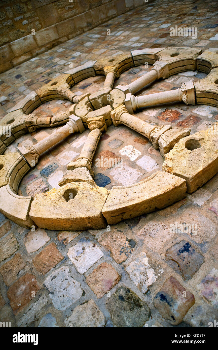 Stone rosette in the paved courtyard of a church in France Stock Photo ...