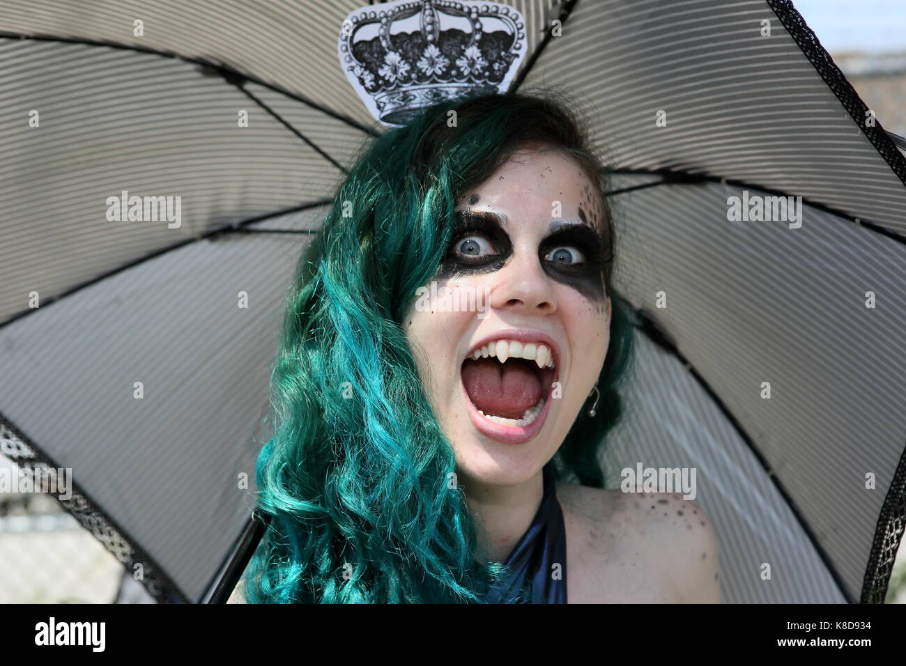 A woman poses for a photograph at the Mermaid Parade in Coney Island ...