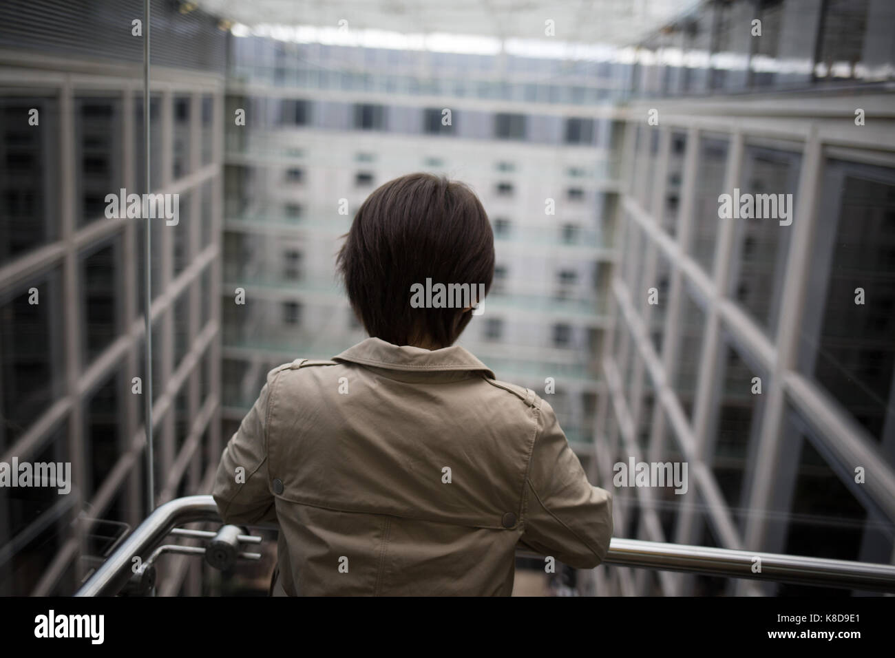 Child looking into modern building, in London, in England Stock Photo ...