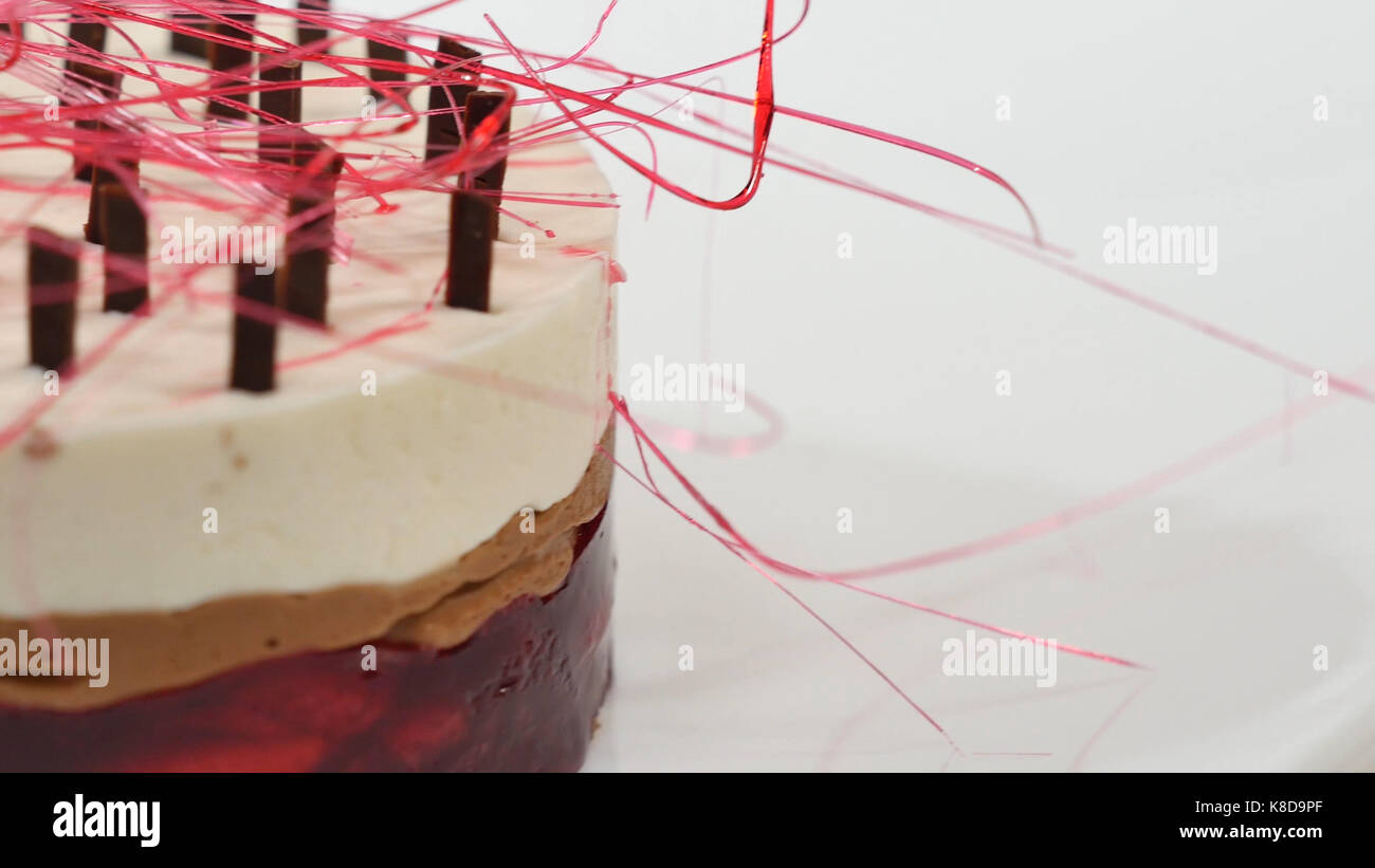 Cream cake with three layers on a plate. Cream cake with three layers ...