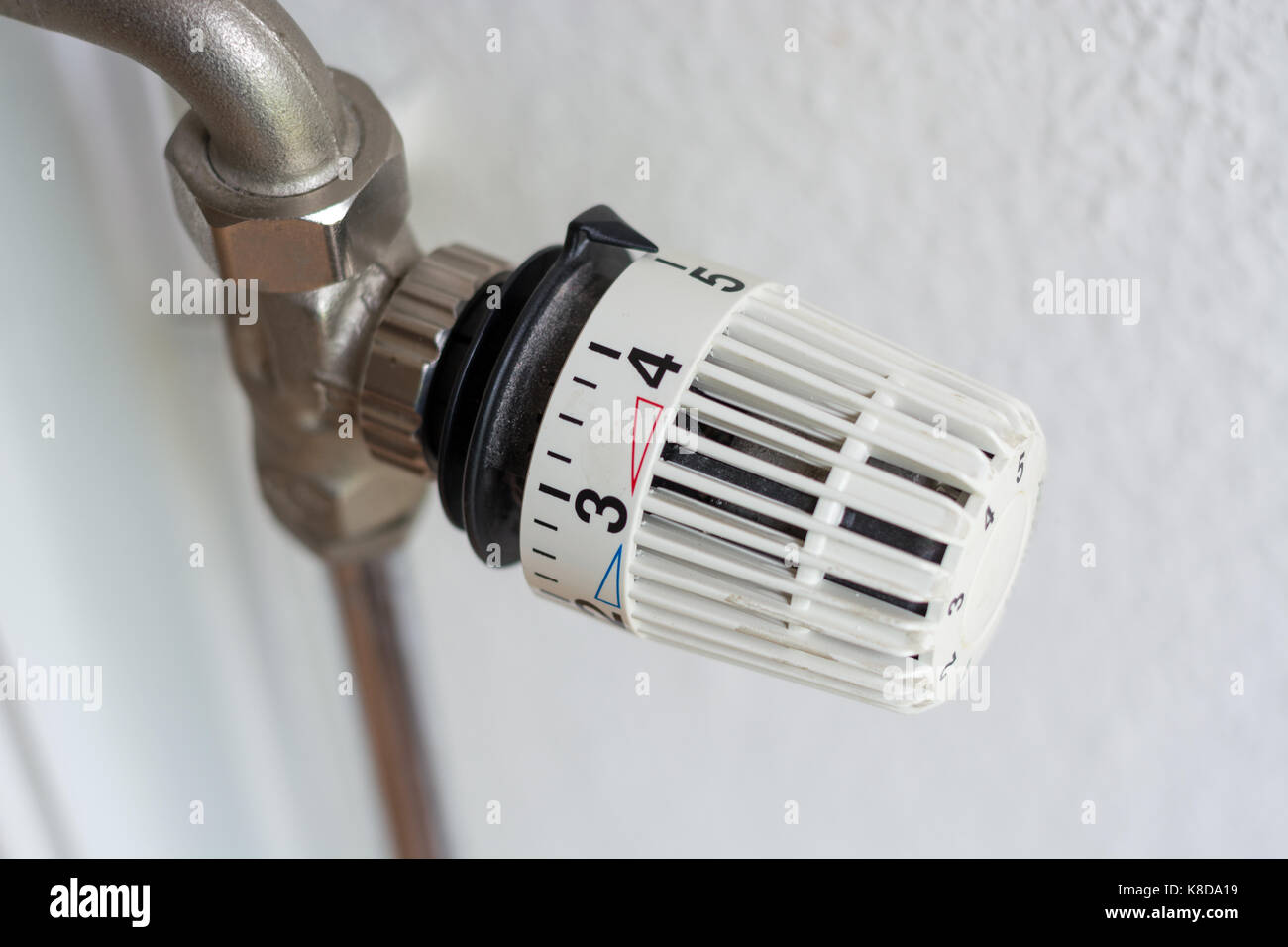 White thermostat of a heating set on high from above Stock Photo - Alamy