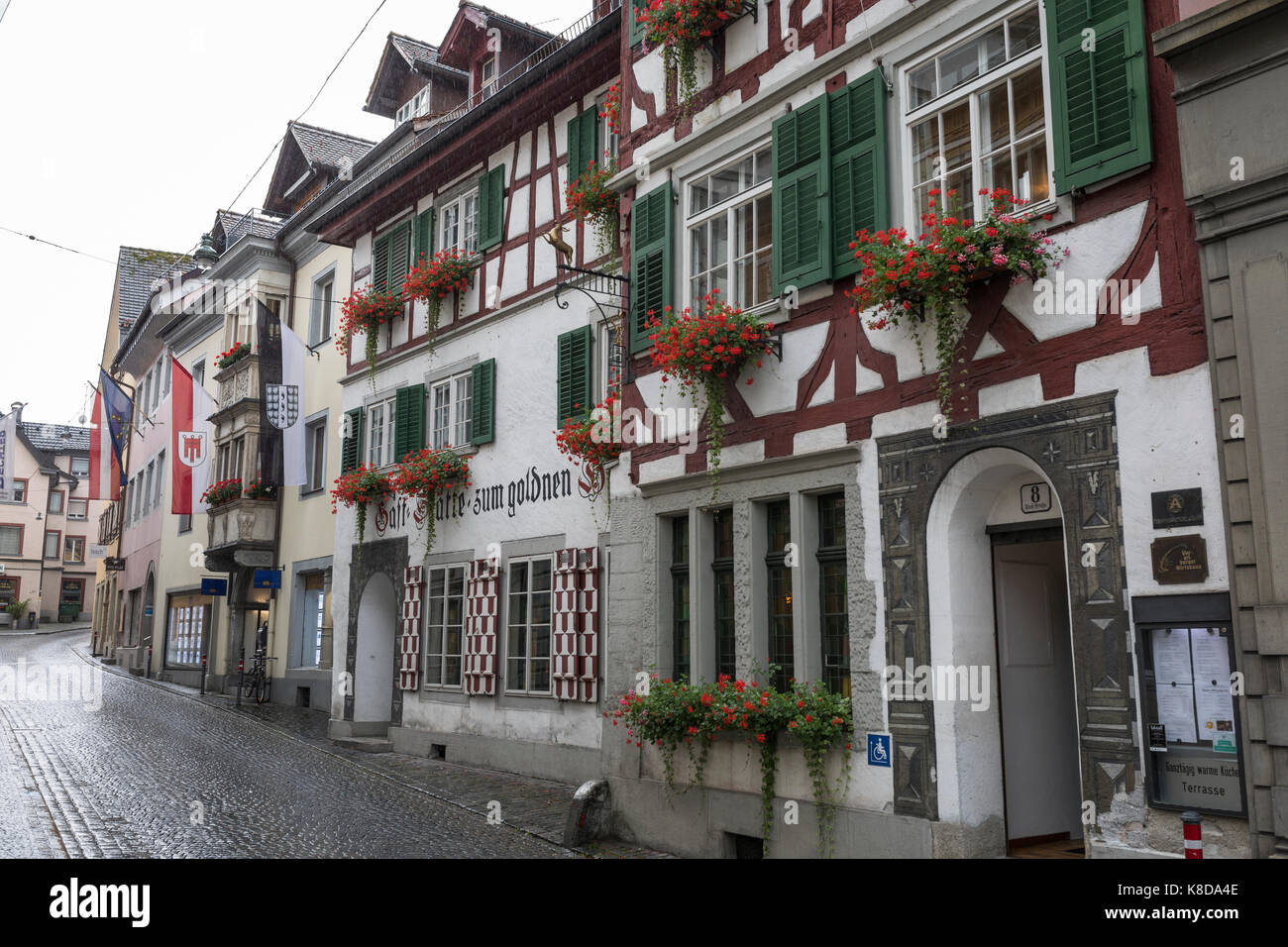 Half timbered house with geraniums on the window sills in Bregenz ...