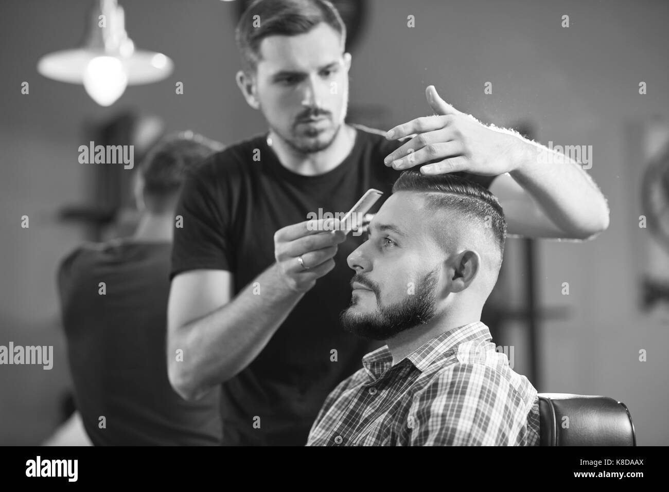 Young man at the barbershop Stock Photo - Alamy