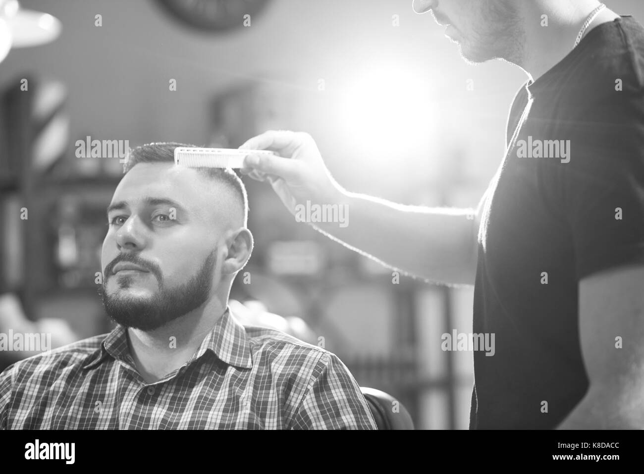 Young man at the barbershop Stock Photo - Alamy