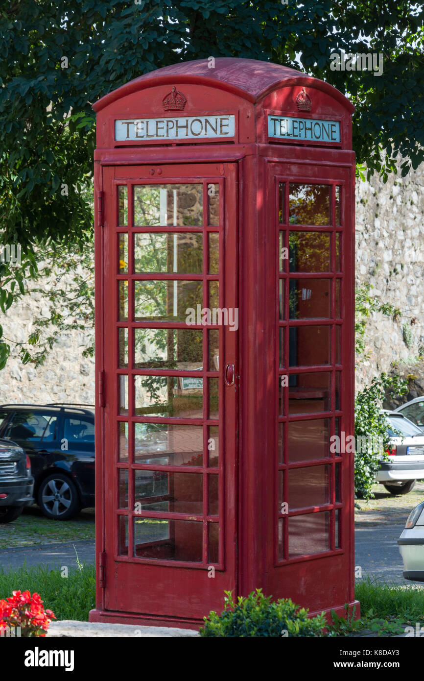 An old red british telephone booth as seen from the front Stock Photo ...