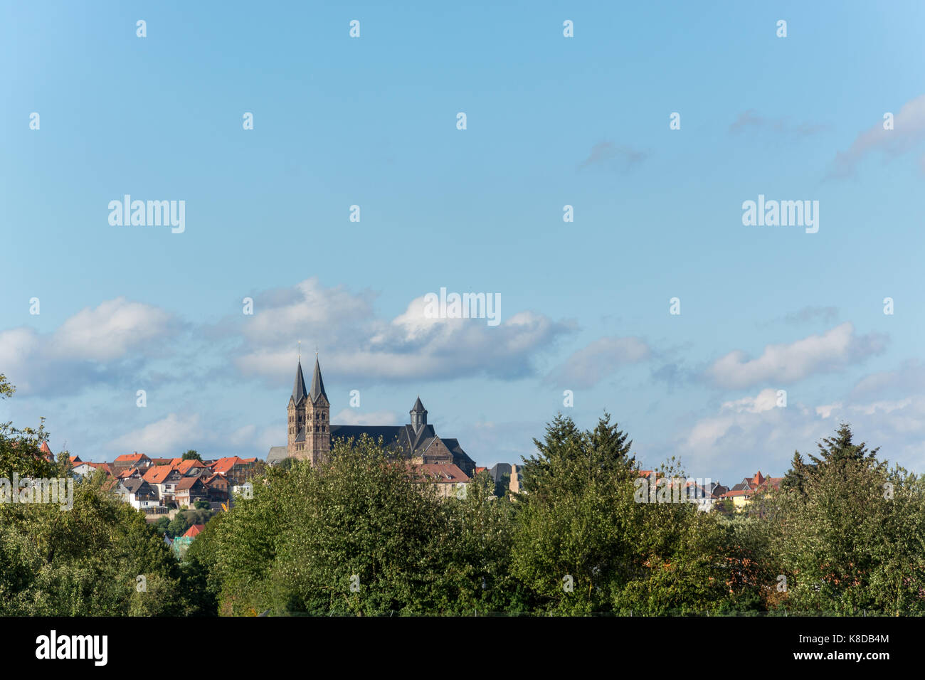 The cathedral of the small German town Fritzlar with blue sky Stock ...